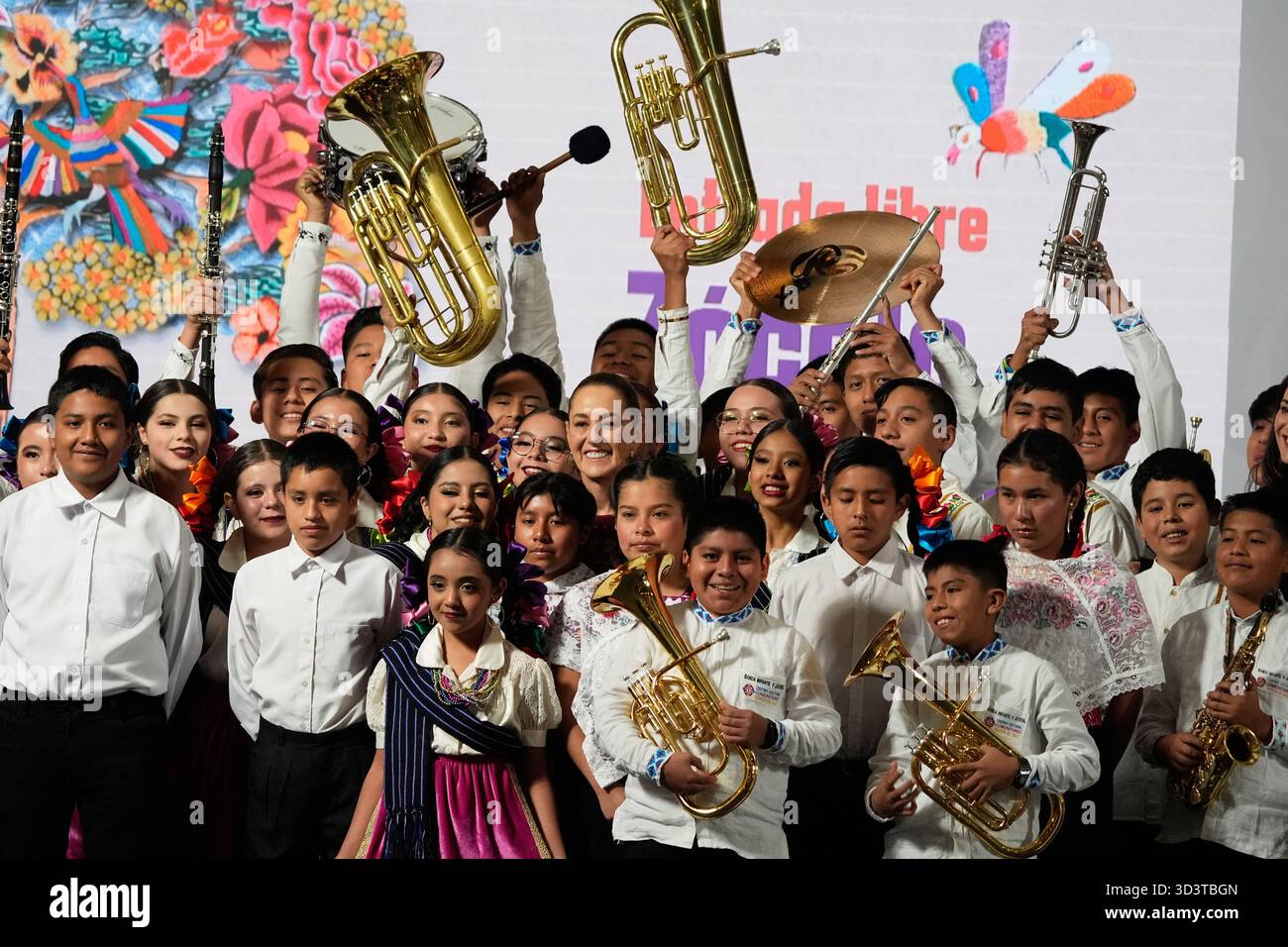 A music band of Indigenous children surrounds Mexican President Claudia ...