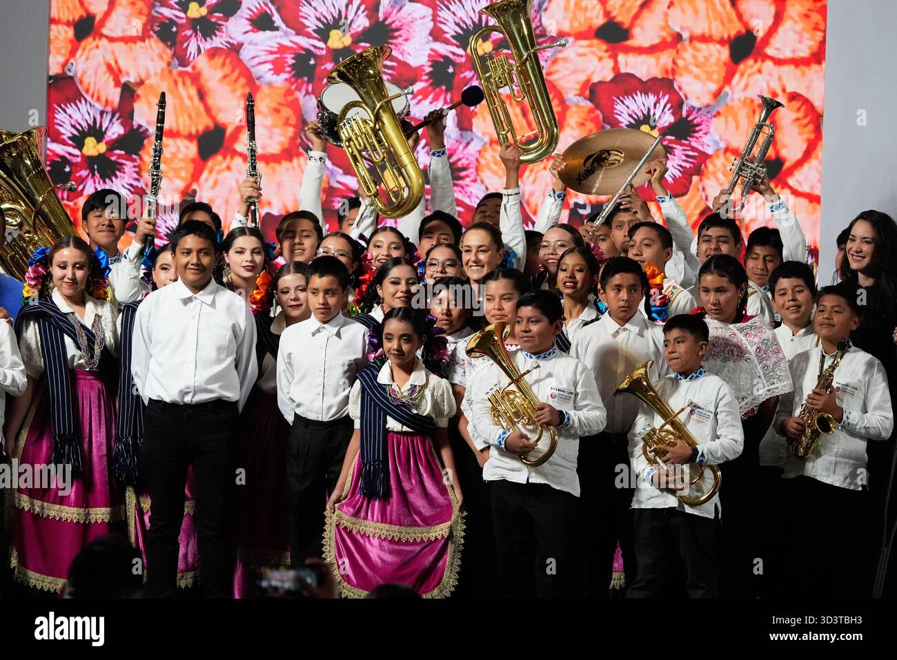 A music band of Indigenous children surrounds Mexican President Claudia ...