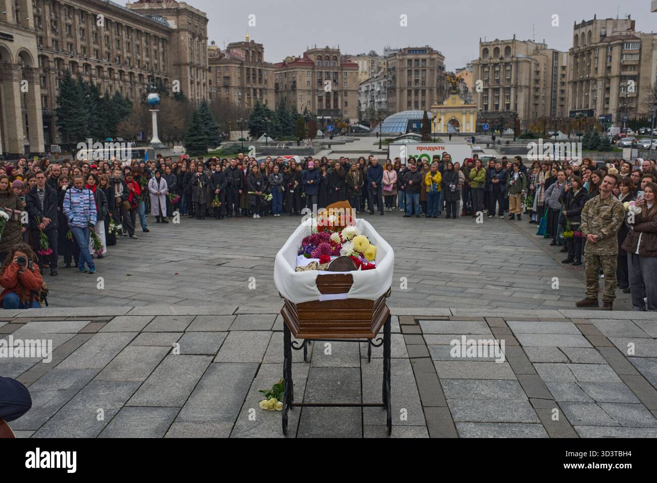 People pay the last respect at the coffin of Kostiantyn Huzenko, 28, a ...