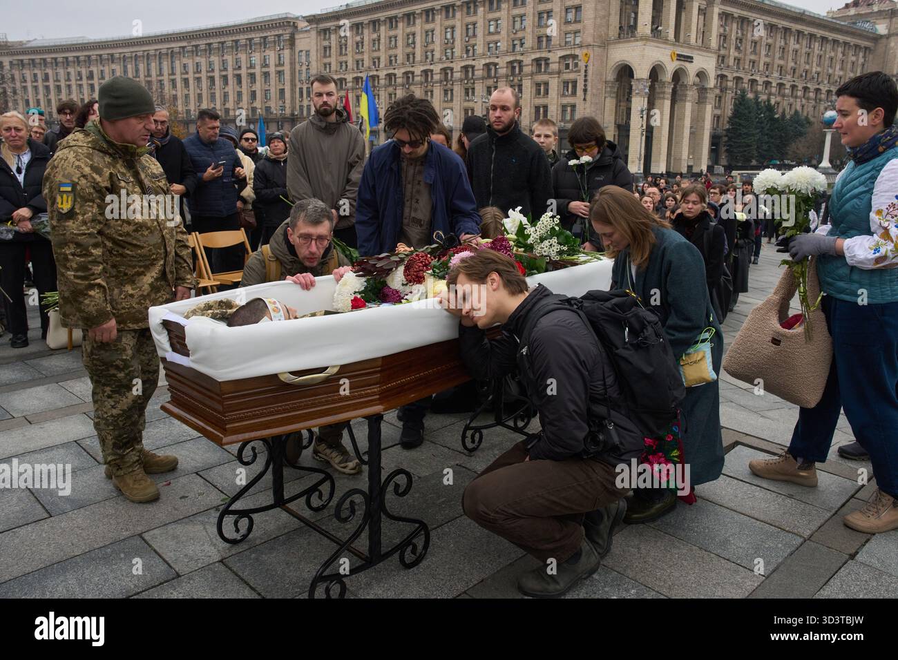 People pay the last respect at the coffin of Kostiantyn Huzenko, 28, a ...