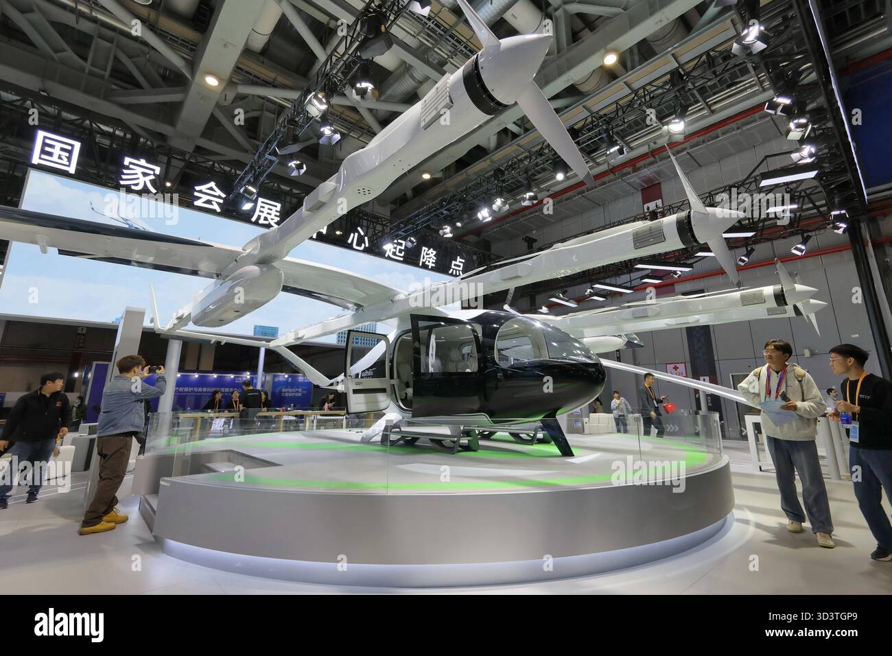Visitors check out the eVTOL Vertaxi Matrix 1 at China International Import Expo in Shanghai ...