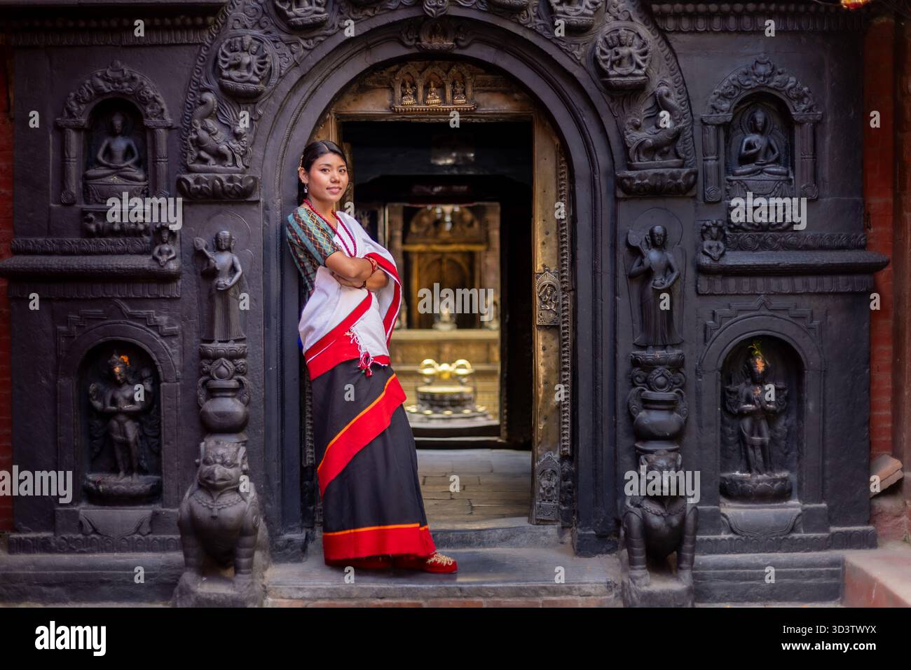 Grace in Heritage: Newari Girl in traditional attire at golden temple ...