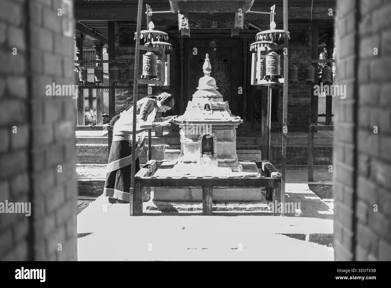 Nepali Newari Girl in Traditional Attire Performing Puja in the Stupa ...