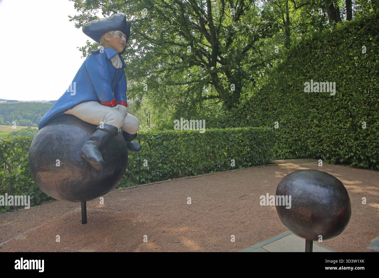 Baron von Muenchhausen sculpture in the castle park, lying baron ...