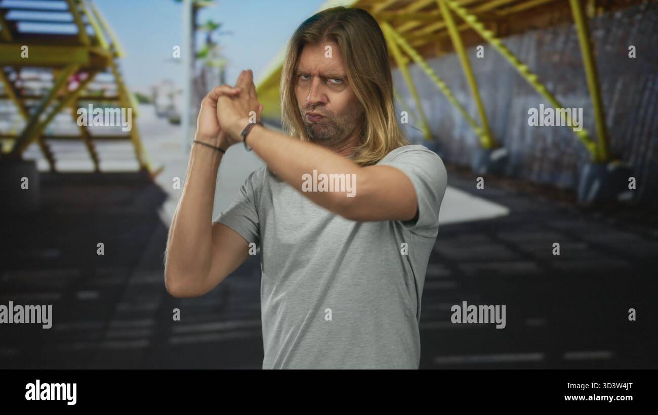 Man forming finger gun hi-res stock photography and images - Alamy