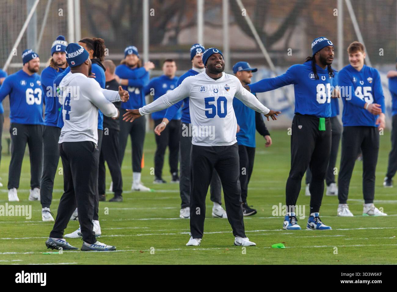 Indianapolis Colts' Segun Olubi (5) and teammates loosen up during NFL ...