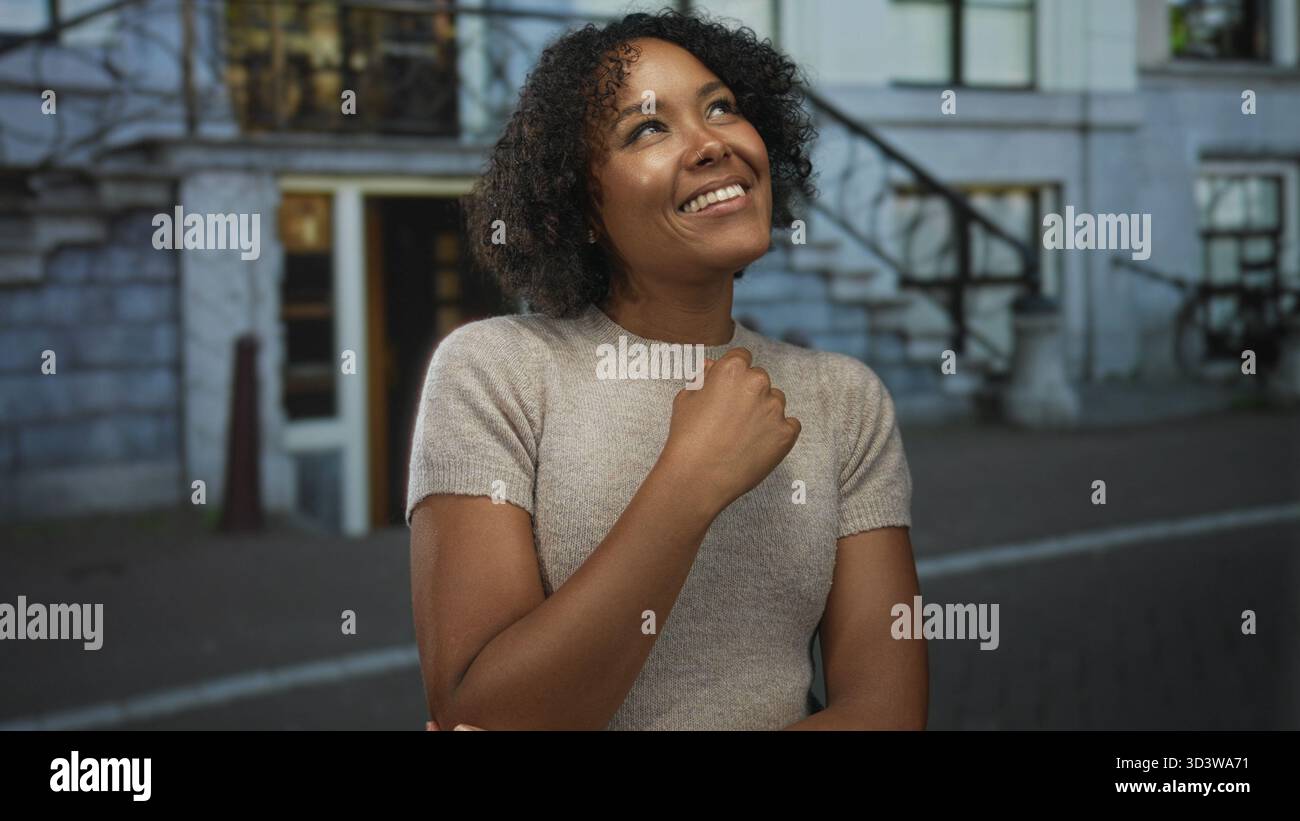 Woman touches chest gentle smile hi-res stock photography and images ...
