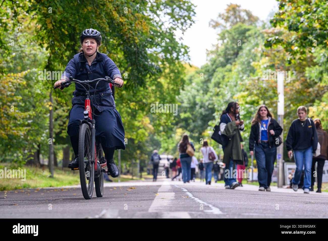 Cyclist Edinburgh Road street Stock Photo - Alamy