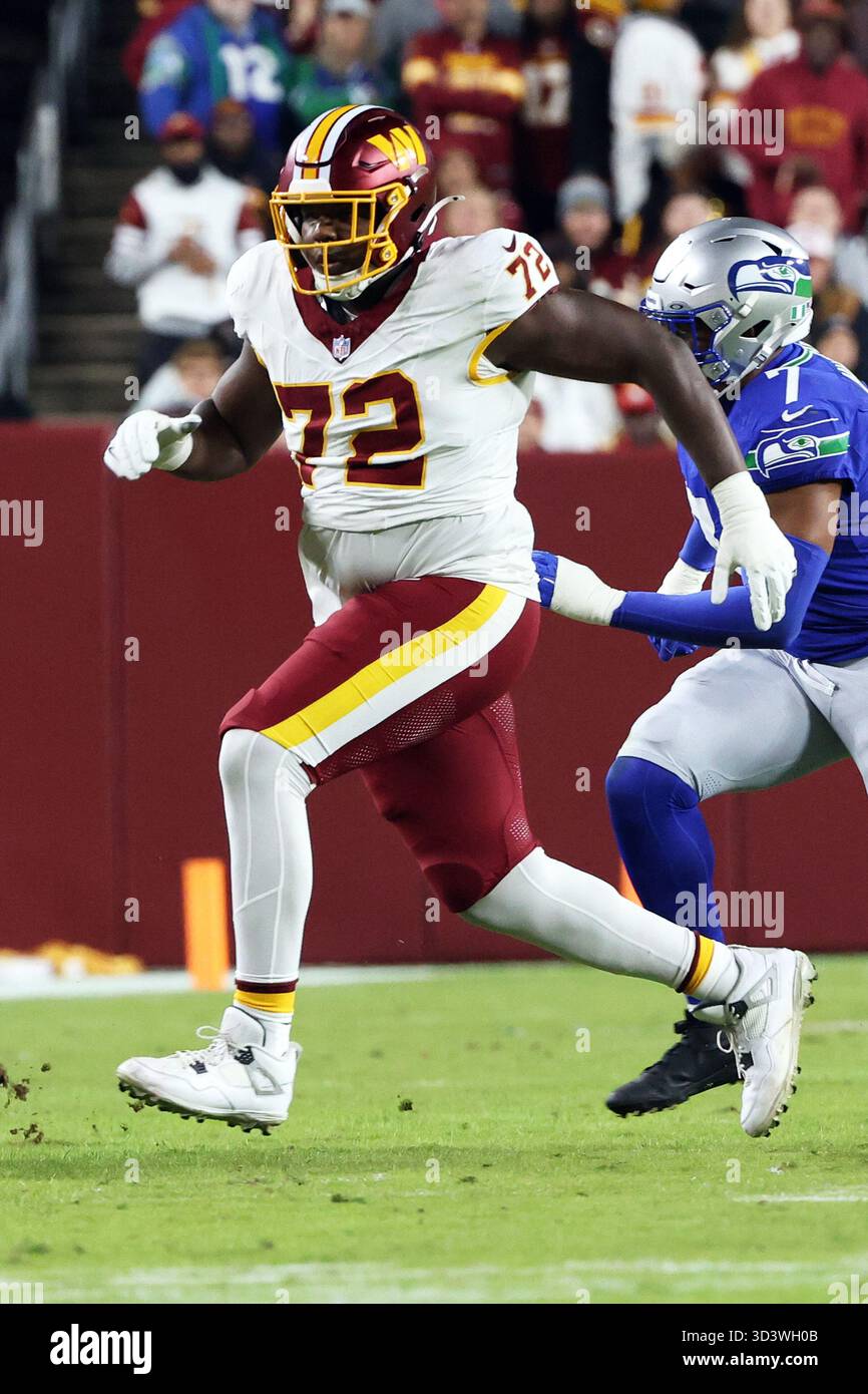 Washington Commanders offensive tackle Josh Conerly Jr. (72) blocks ...
