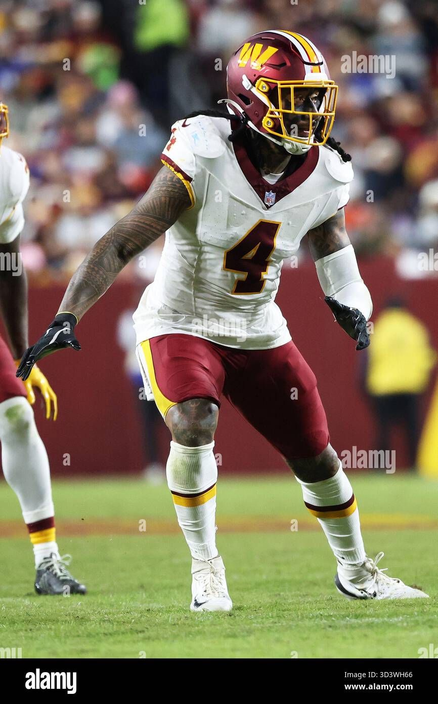Washington Commanders linebacker Frankie Luvu (4) rushes during an NFL ...