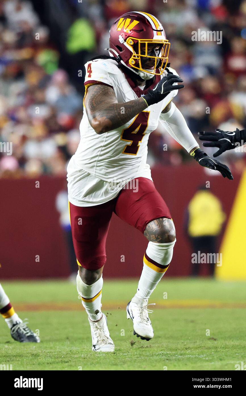 Washington Commanders linebacker Frankie Luvu (4) rushes during an NFL ...