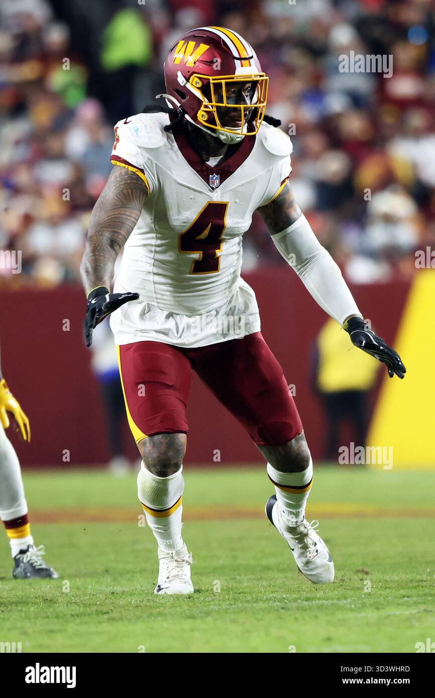 Washington Commanders linebacker Frankie Luvu (4) rushes during an NFL ...