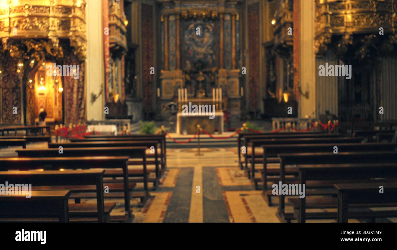Blurred church interior with shallow bokeh focus showing pews, aisle ...
