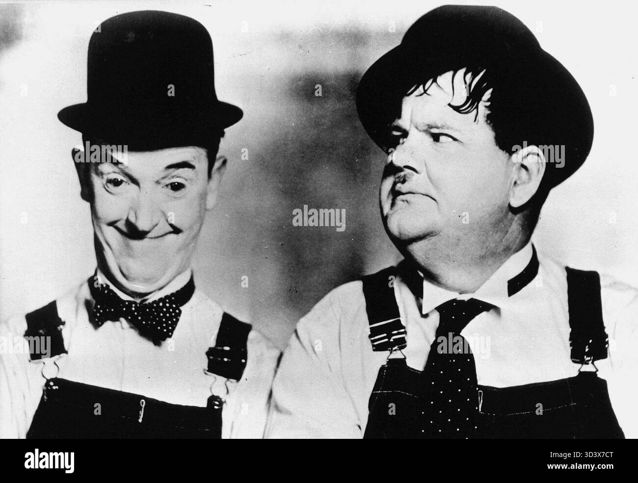 Stan Laurel and Oliver Hardy, the famous comedy duo, are depicted here ...