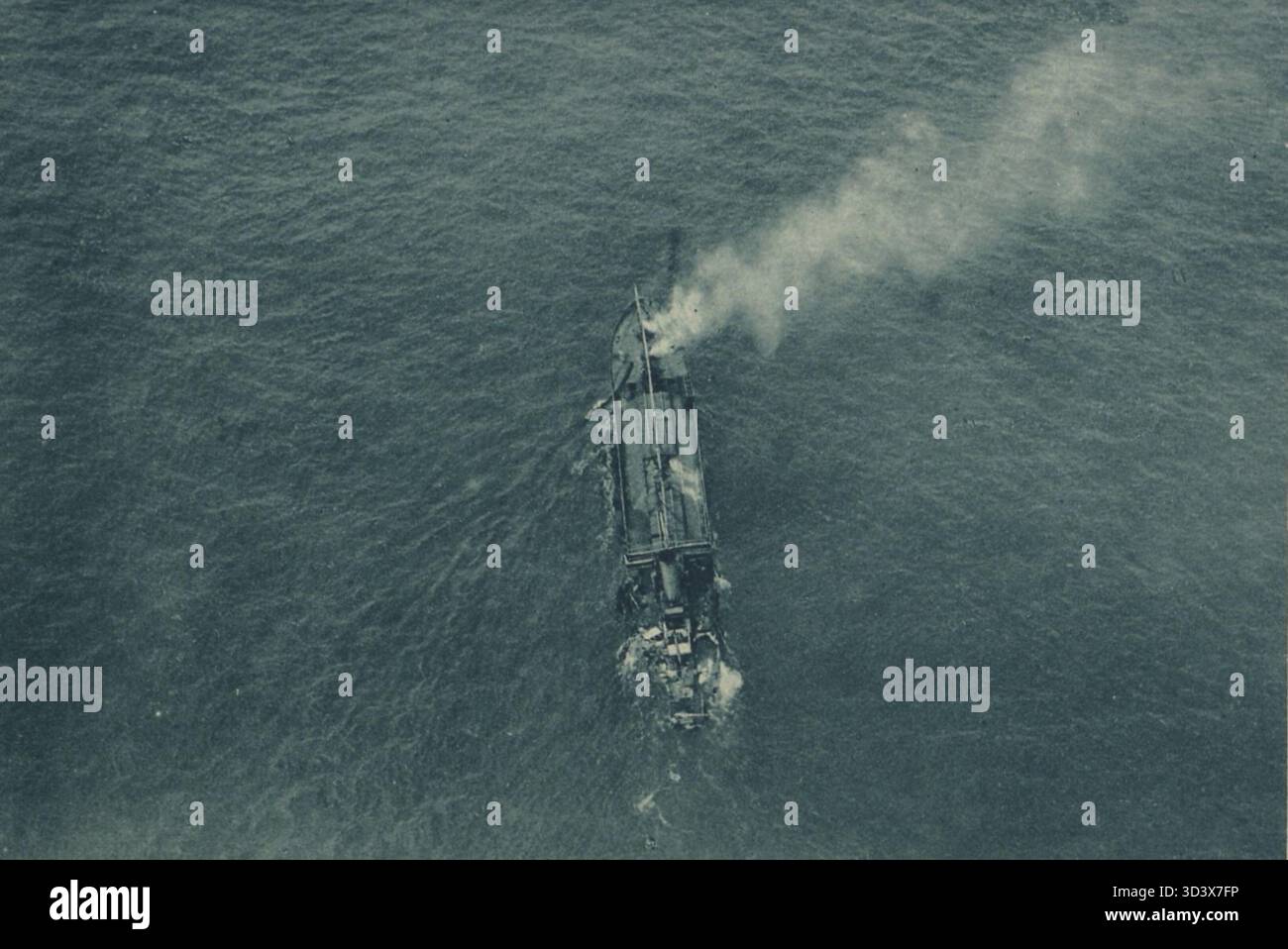 An air photograph captures the steamer Audax after being torpedoed and ...
