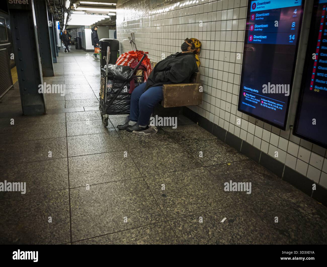 Sleeping homeless in the West 28th Street subway station in New York on ...