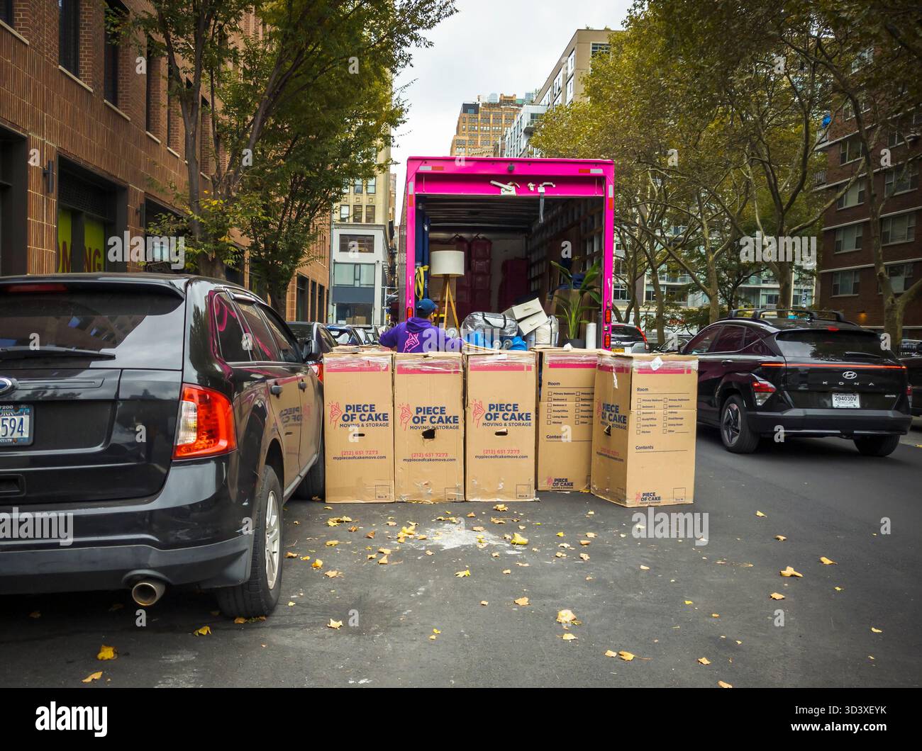 Workers unload a moving van in the Chelsea neighborhood in New York on ...