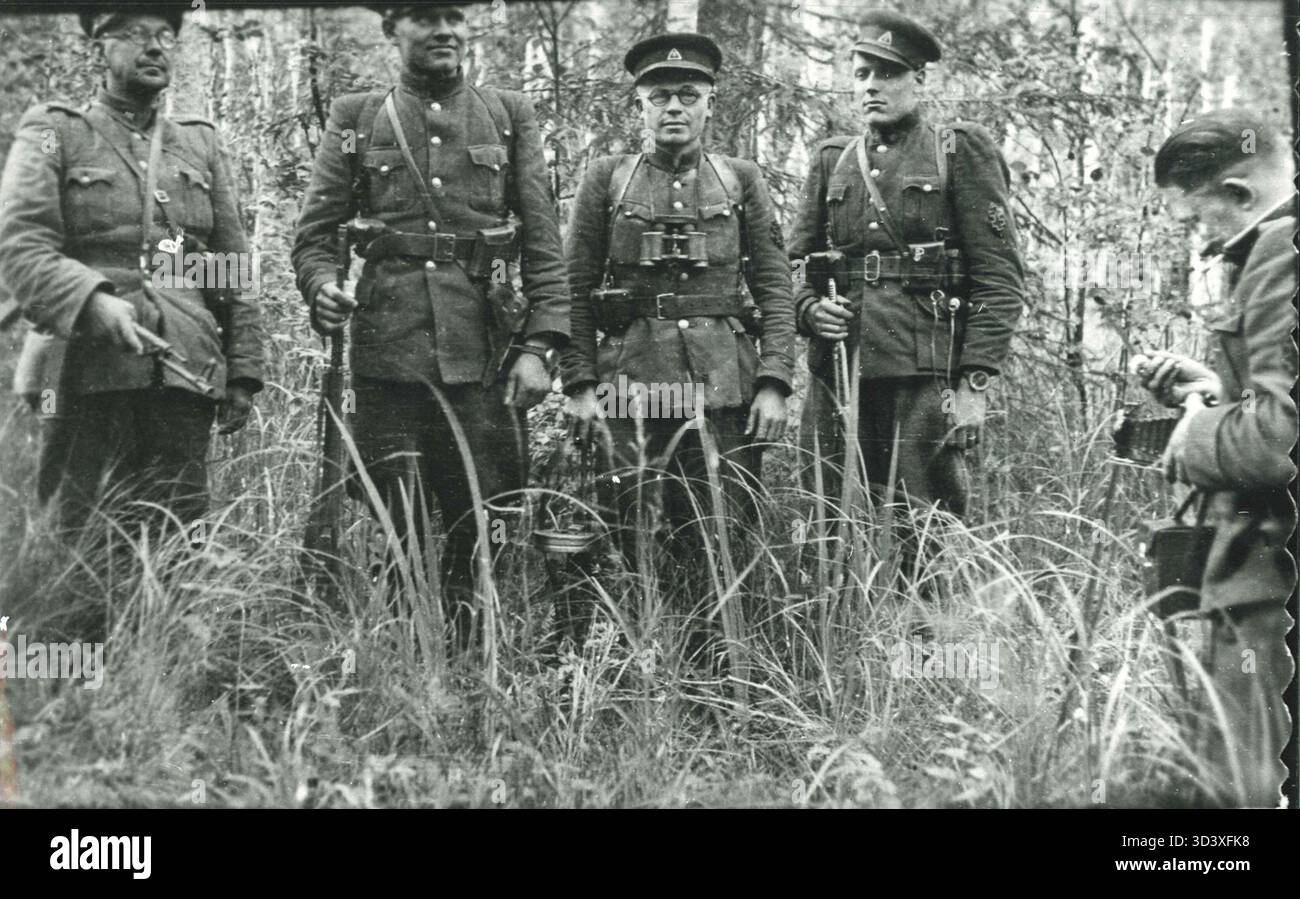 Lithuanian partisans photographed in a forest in 1950, continuing their ...