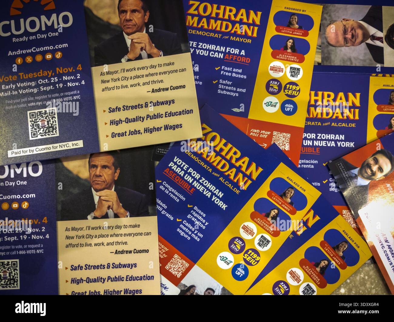 A collection of palm cards promoting Zohran Mamdani and Andrew Cuomo on ...