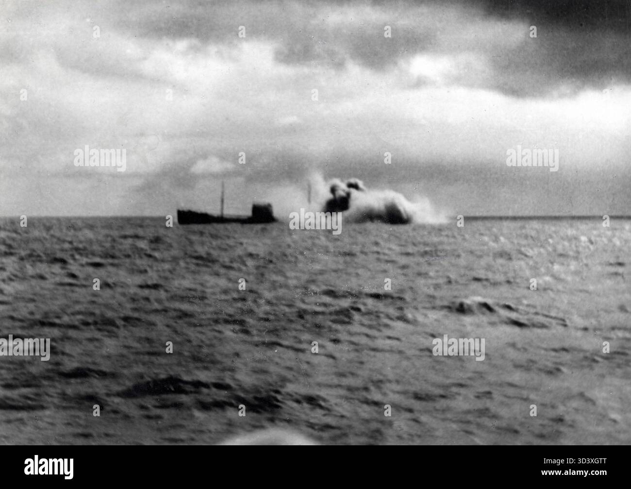 A photograph from 1939 showing a British tank ship torpedoed by a ...