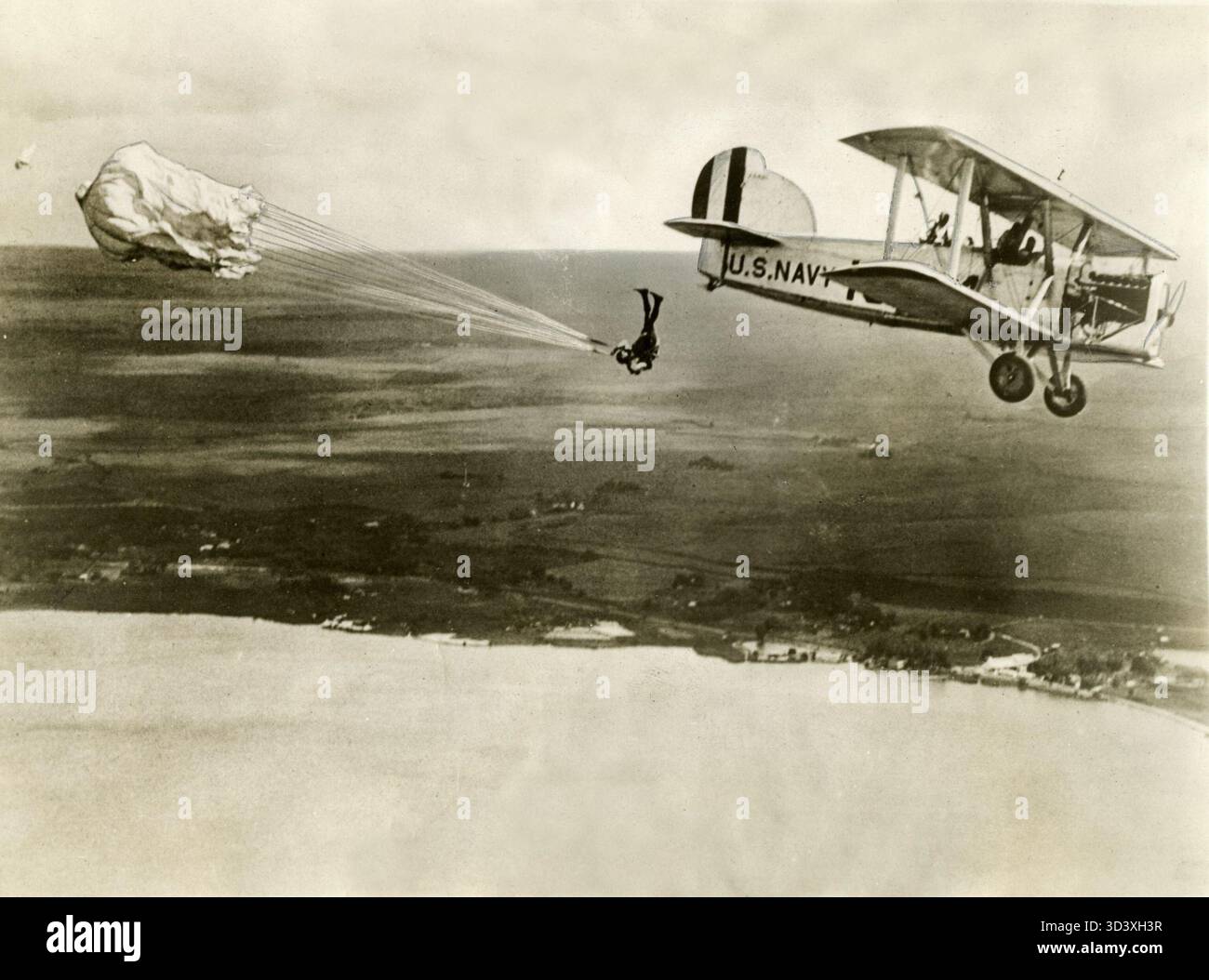 A photograph from 1925 showing a parachute jump from a U.S. Navy plane ...