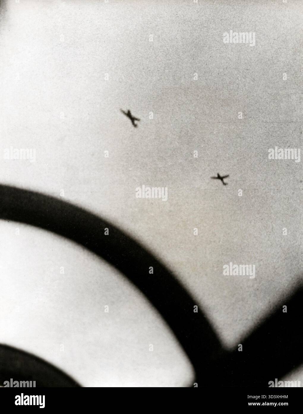 A German pilot in a Messerschmitt dives to attack a Spitfire during a ...