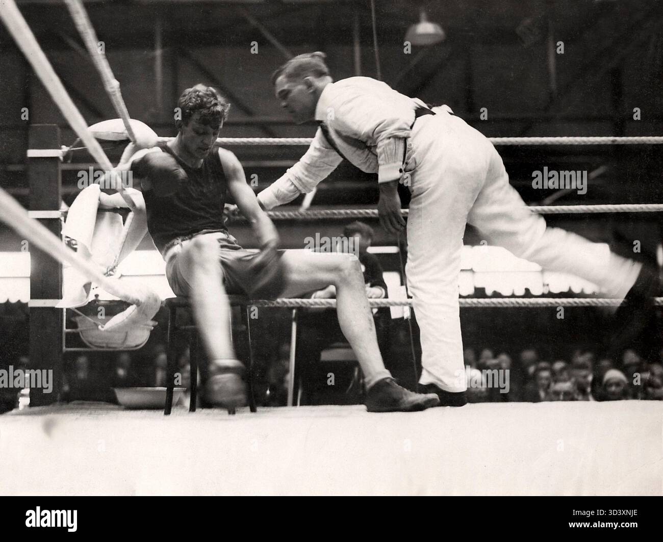 This photo from the 1928 Olympics in Amsterdam shows a boxer recovering ...