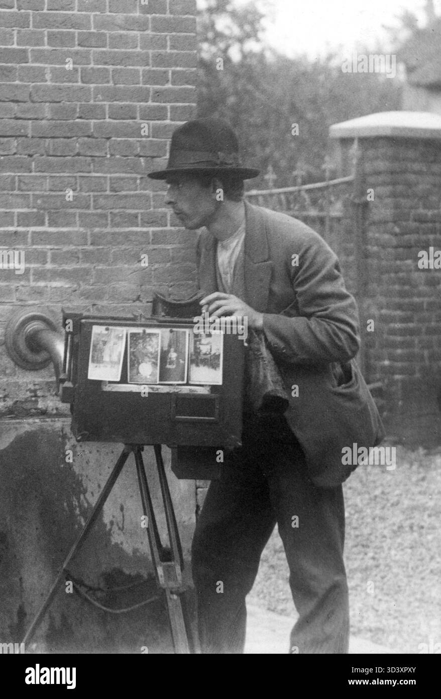 Photographer in action early Black and White Stock Photos & Images - Alamy