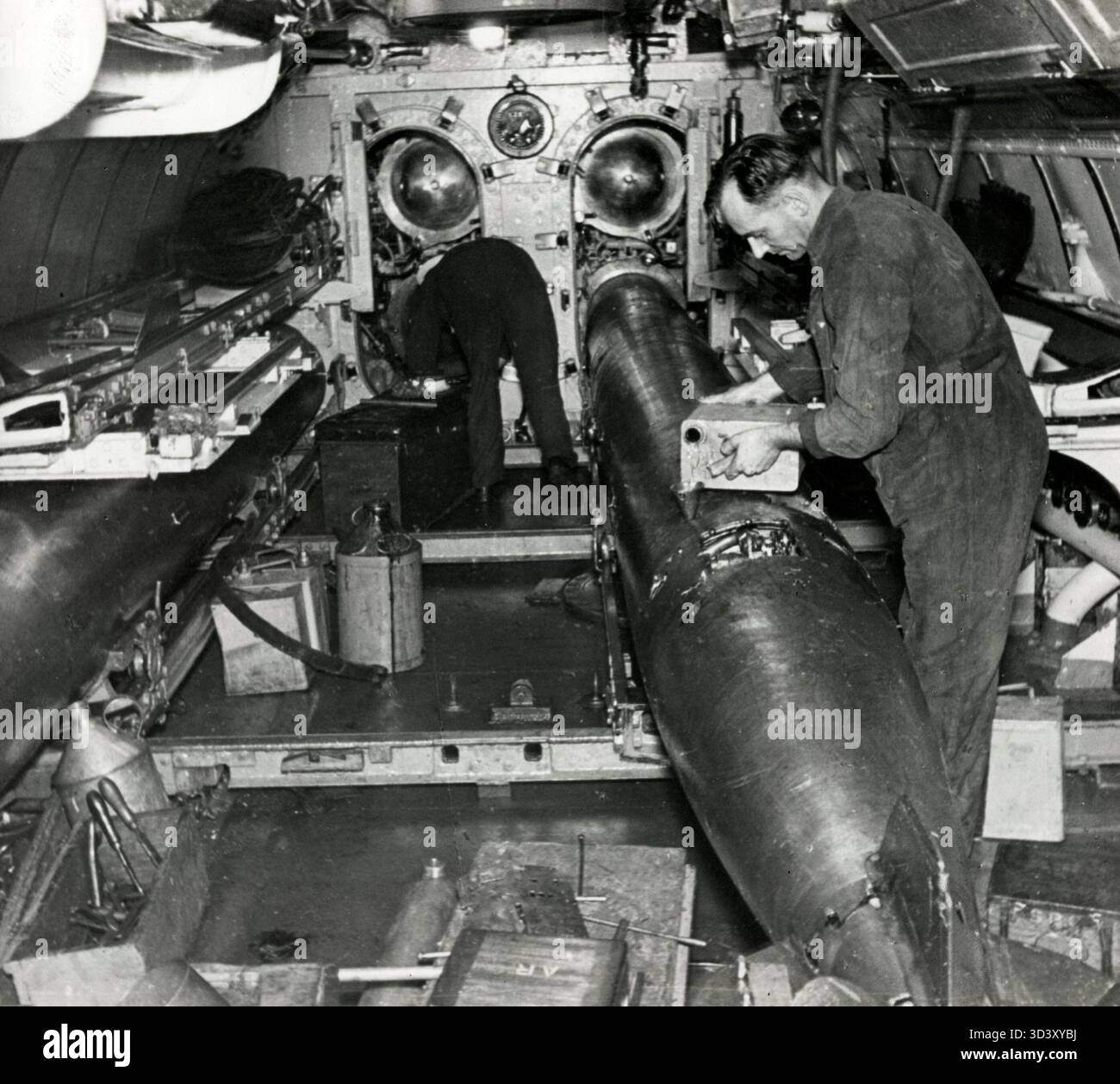 Onboard a sister ship of the British submarine Thetis, torpedo makers ...