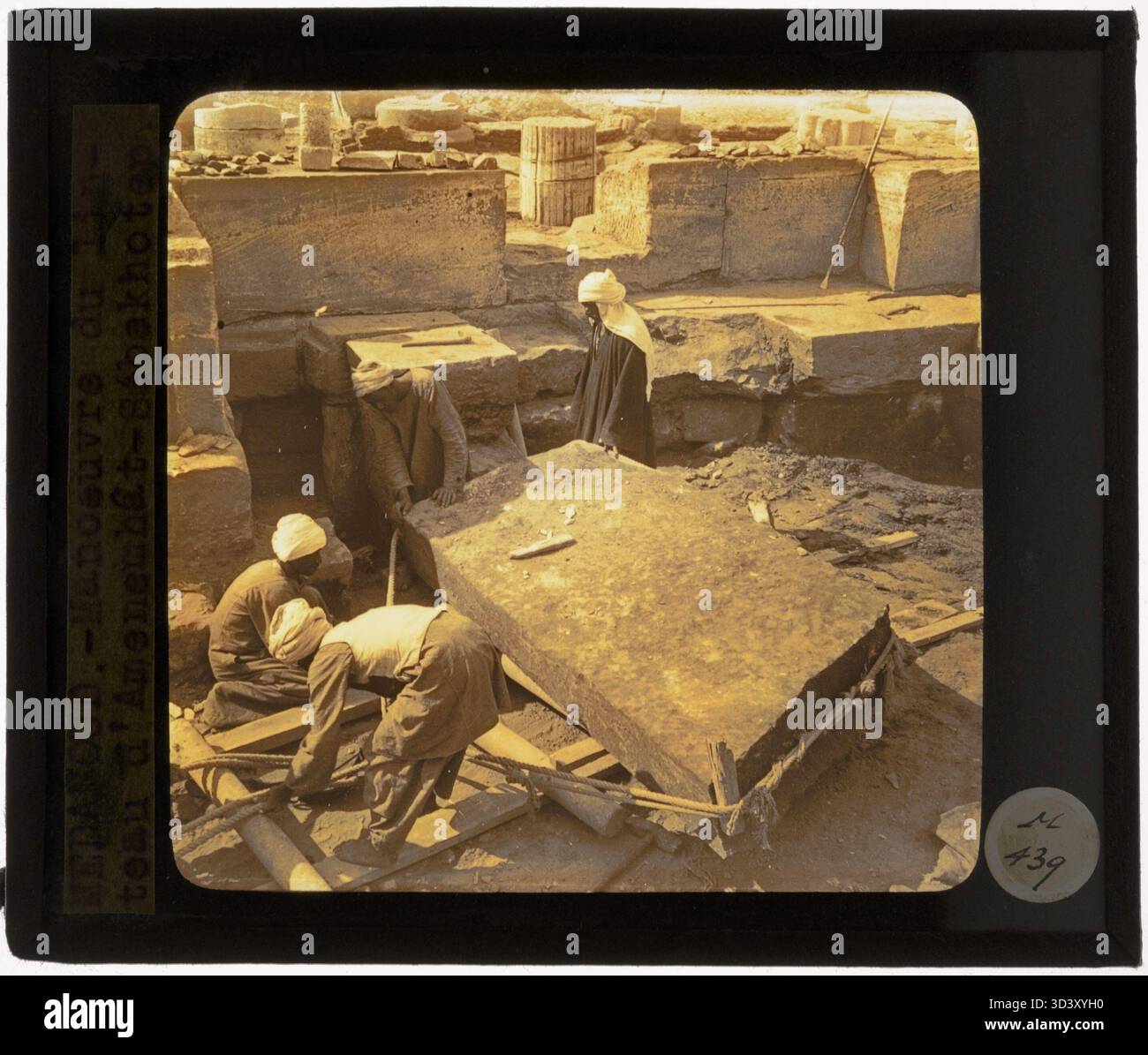 Photograph showing workers preparing the relocation of the lintel of ...