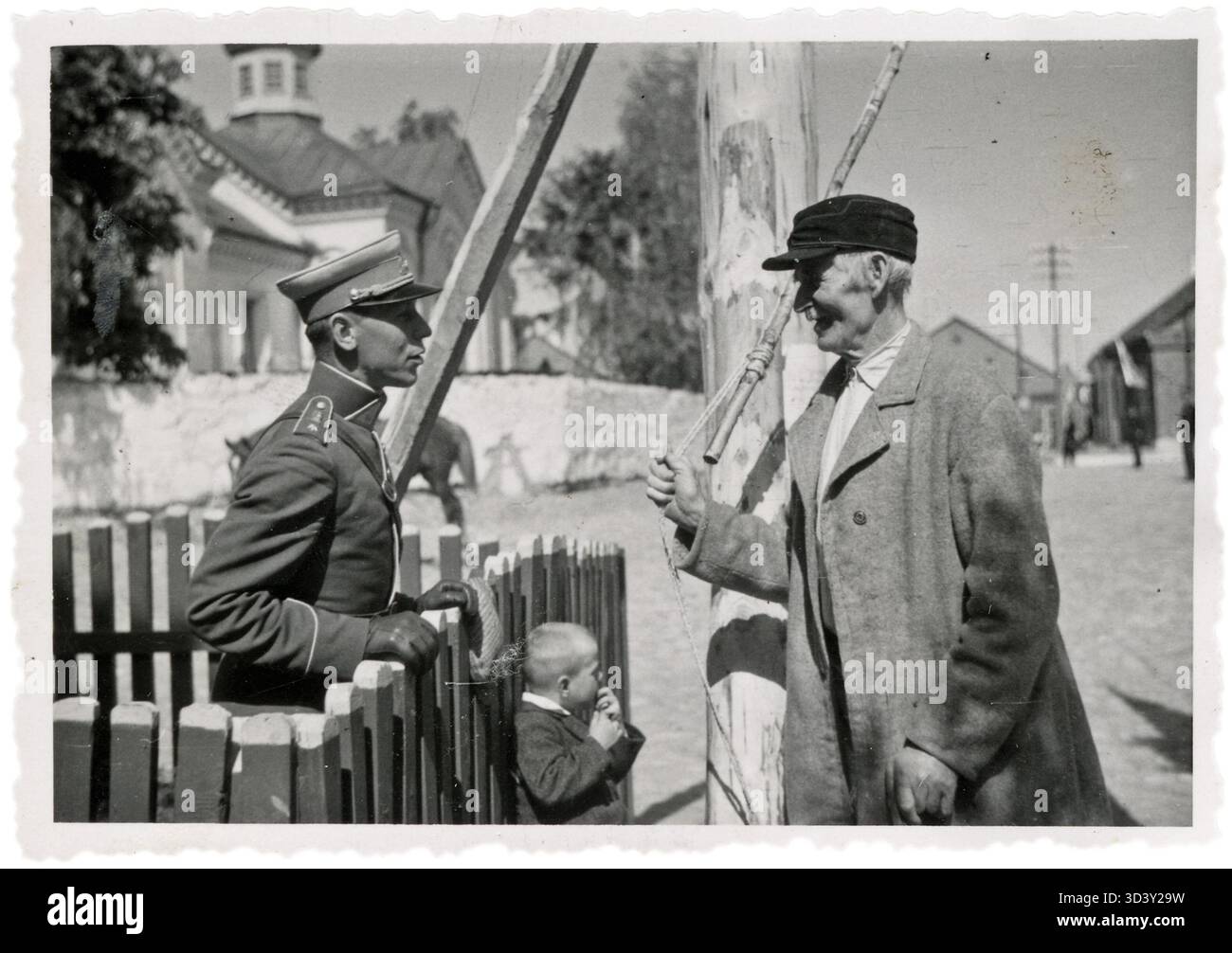 This 1935 photograph shows three generations of townspeople in Merkin ...