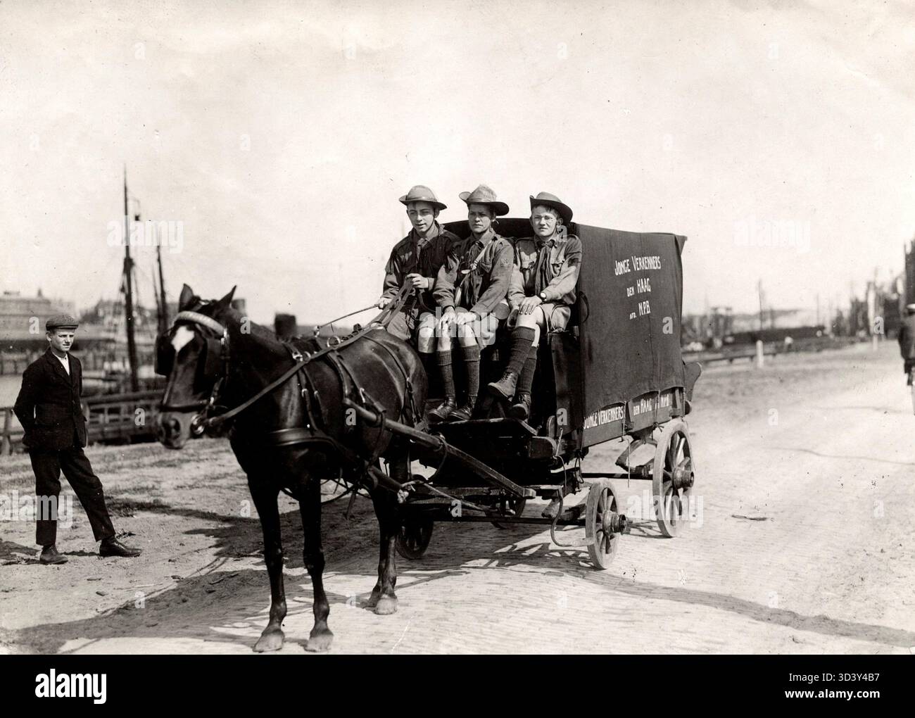 In 1913, three young scouts in IJmuiden, Netherlands, are pictured ...