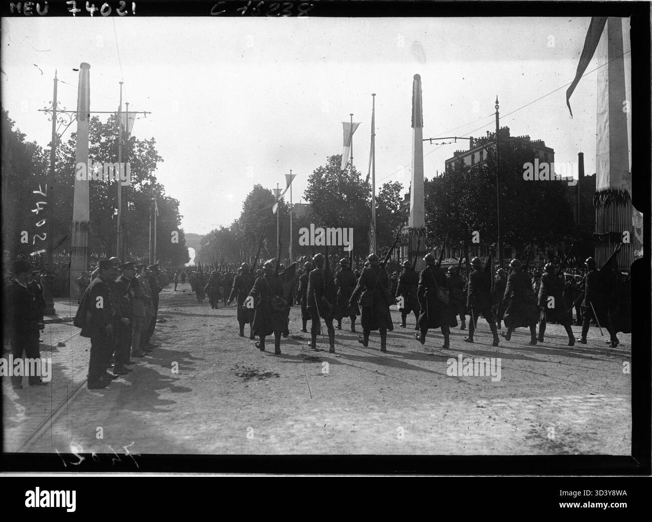 On 14 July 1919, French troops march towards the Arc de Triomphe during ...