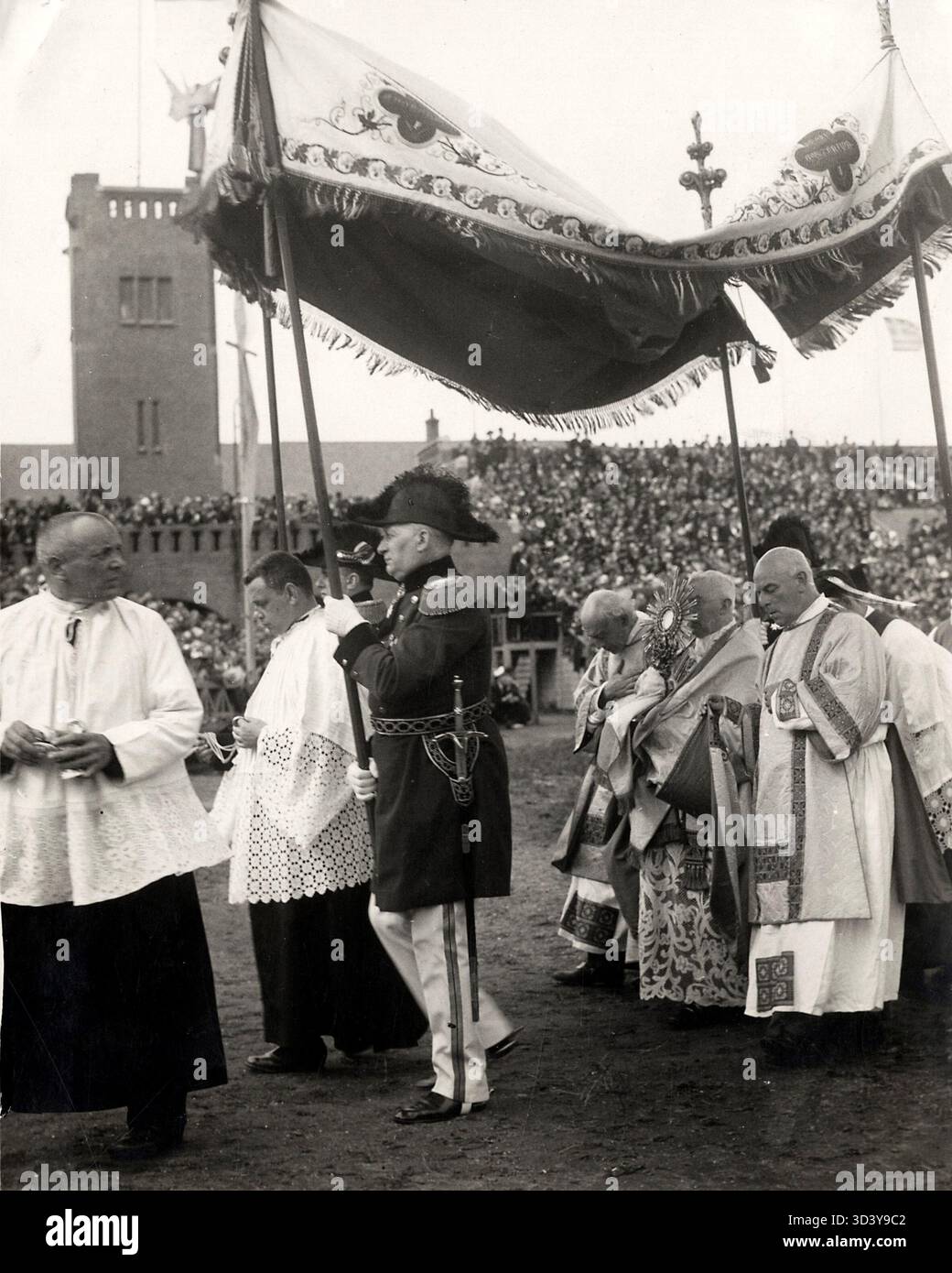 Cardinal F.A. Bourne, Archbishop of Westminster, walks in a procession ...