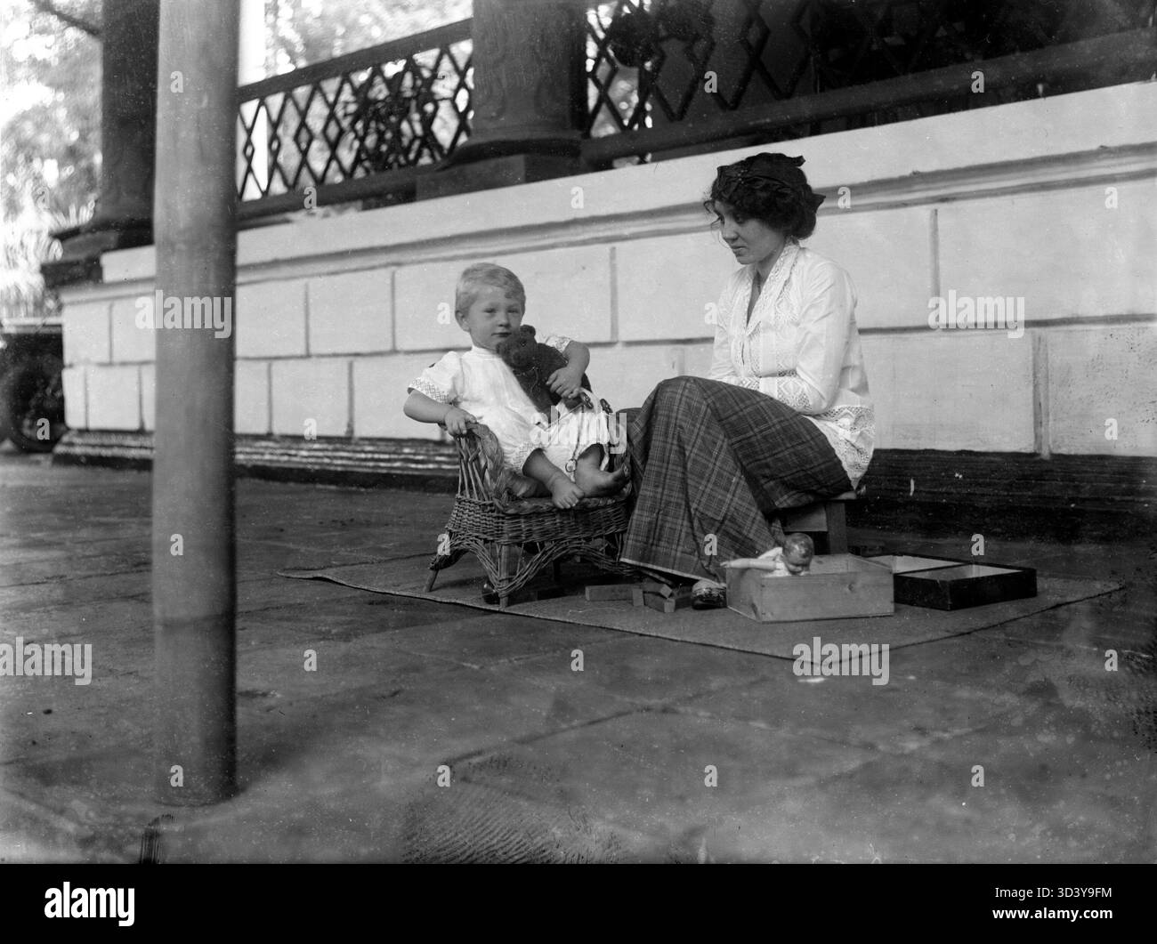Melina Maas-Elzinga with her son Bob, sitting with a toy bear on wheels ...