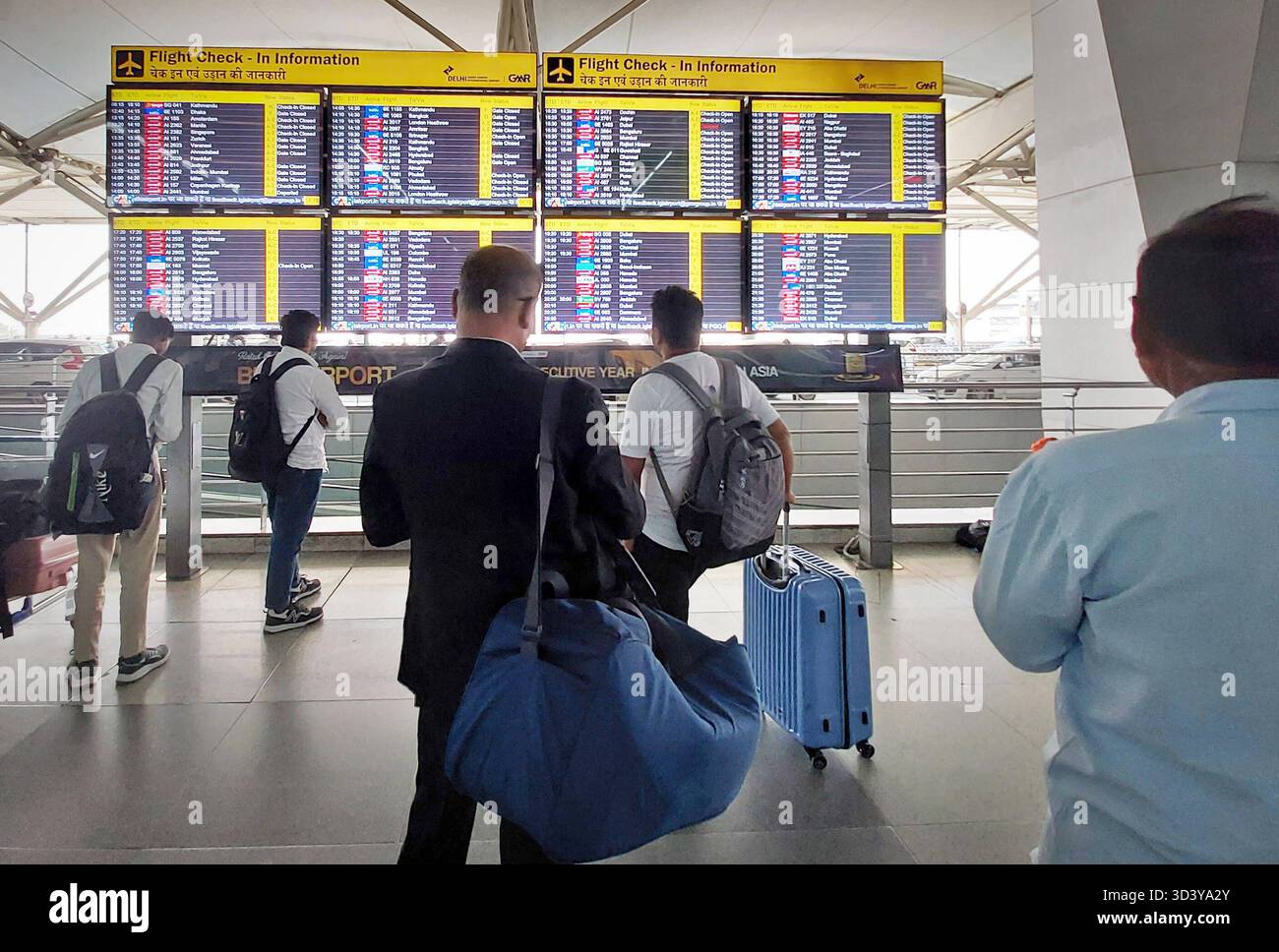 NEW DELHI, INDIA - NOVEMBER 7: People wait outside the departure ...