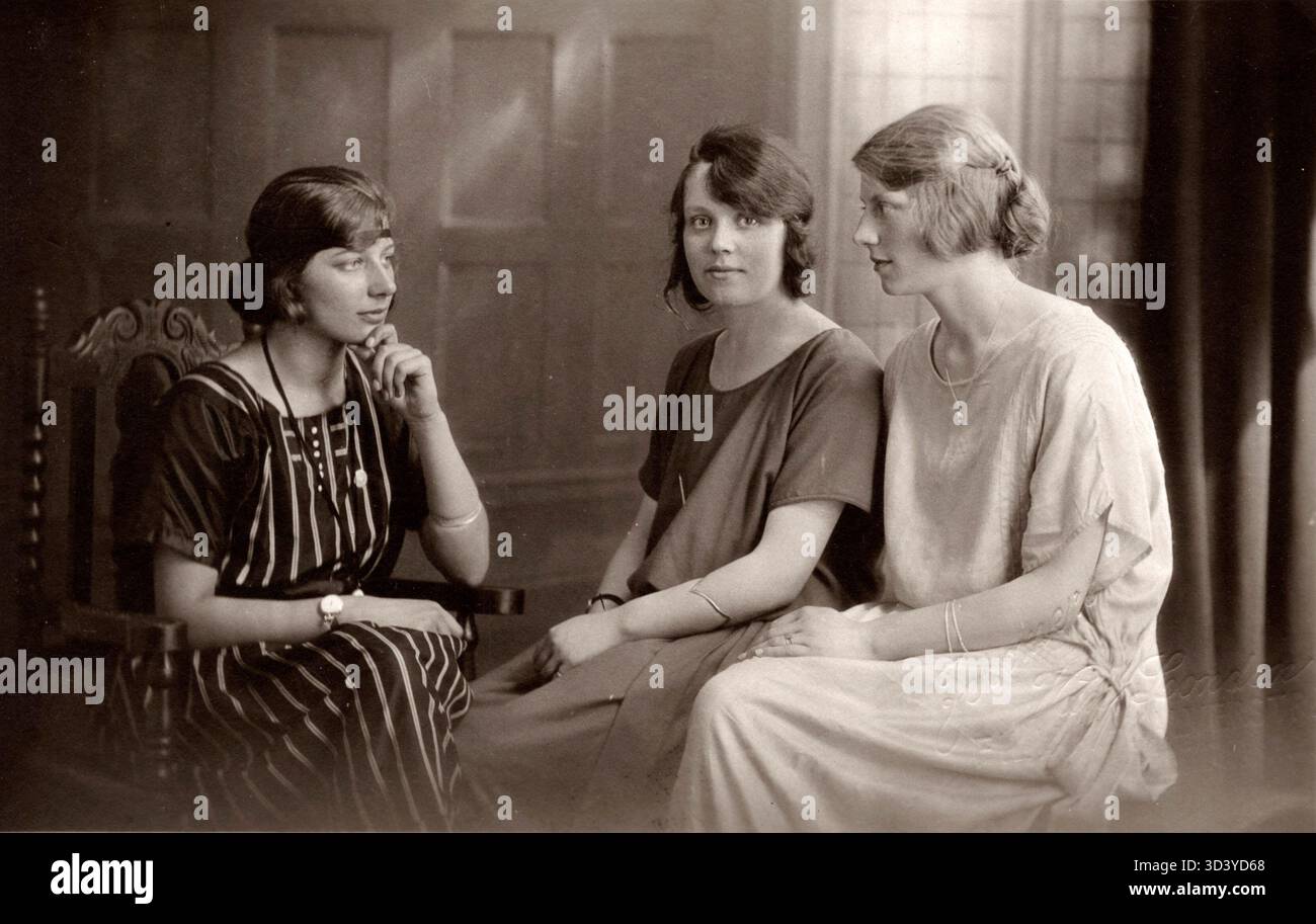 A posed photograph of three young women taken in 1924. The image ...