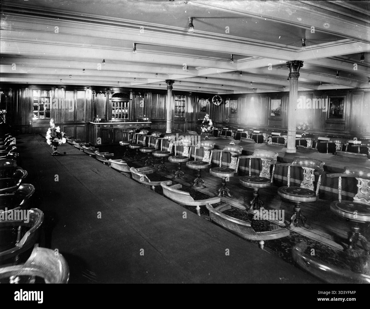 An ornate interior with colonial swivel chairs on board a ship in ...