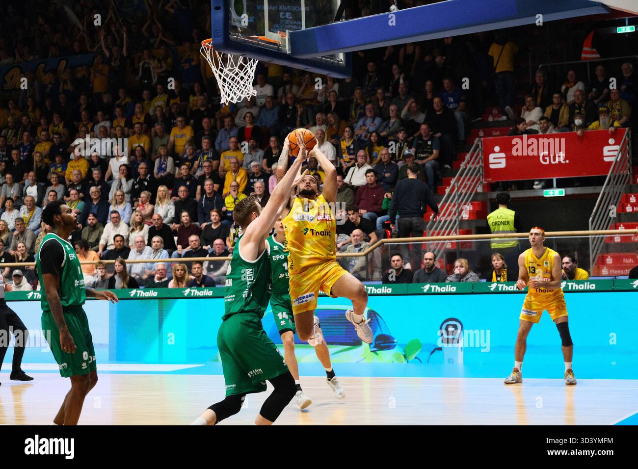 Marcus Graves (Phoenix Hagen, #0, Guard) going for a layup, being ...