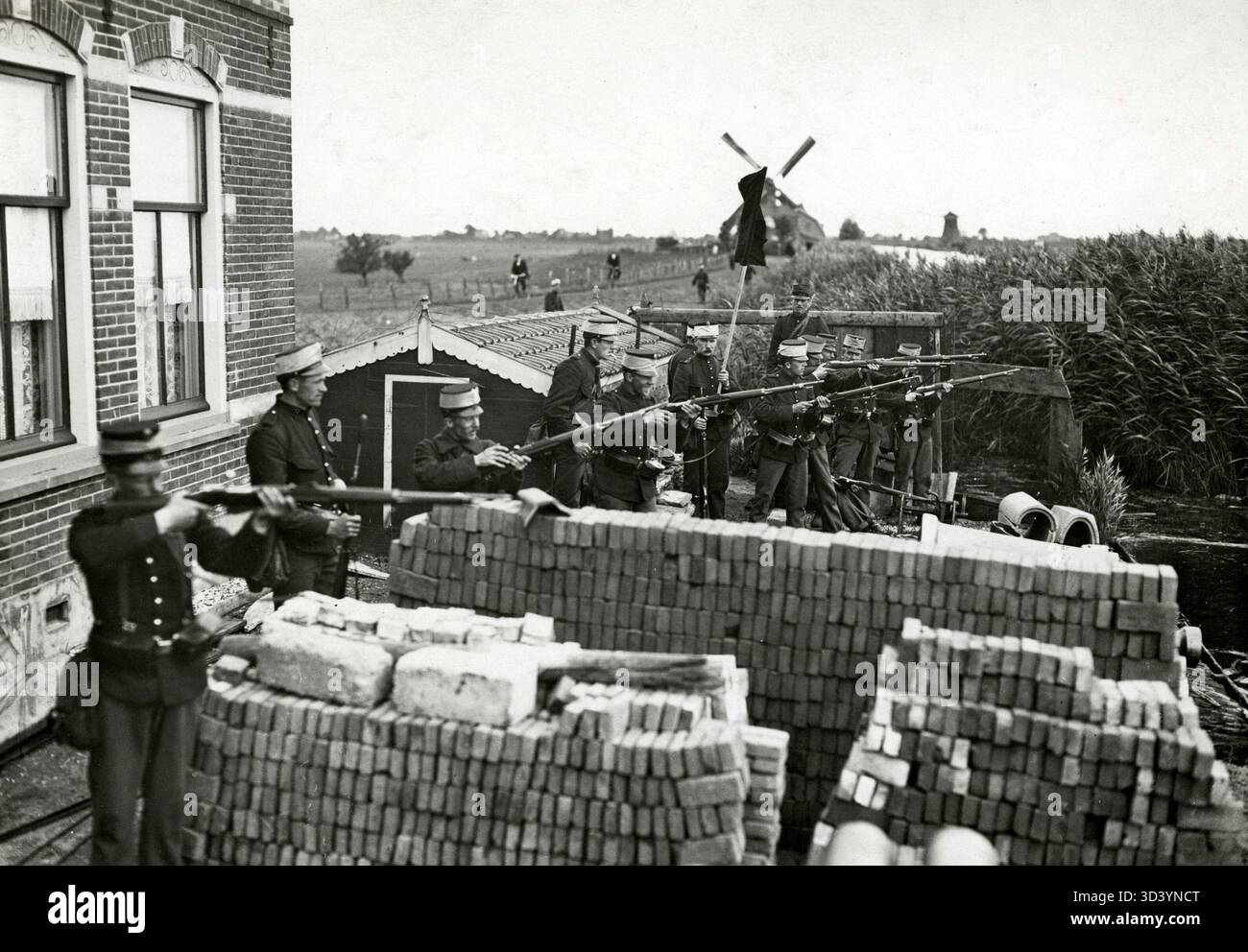 Dutch Army soldiers during maneuvers in 1912, taking cover behind stone ...