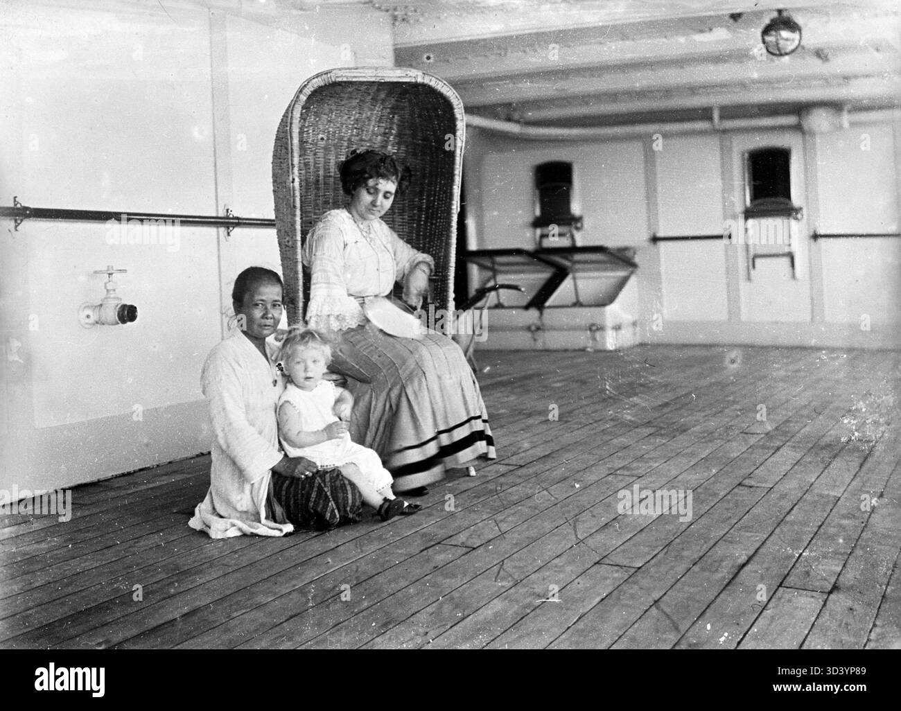 Melina Elzinga-Maas is sitting in a deck chair with her son Bob on her ...