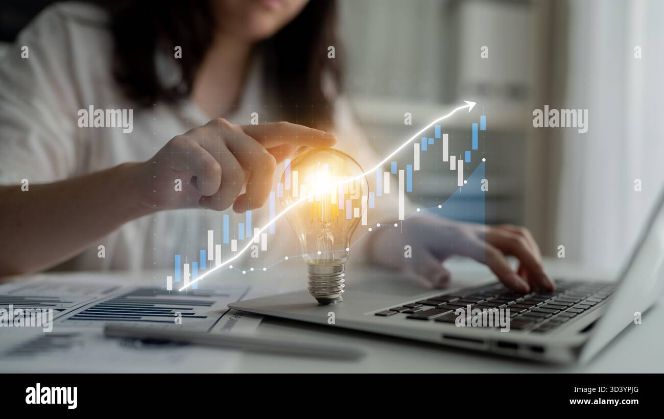A business professional generates innovative ideas depicted by a light ...