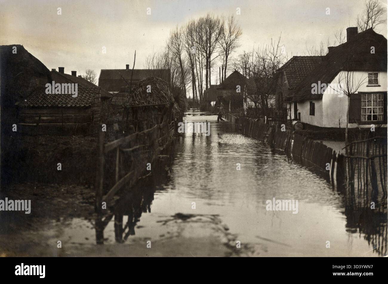 A village in the Netherlands submerged by floodwaters in March 1914 ...
