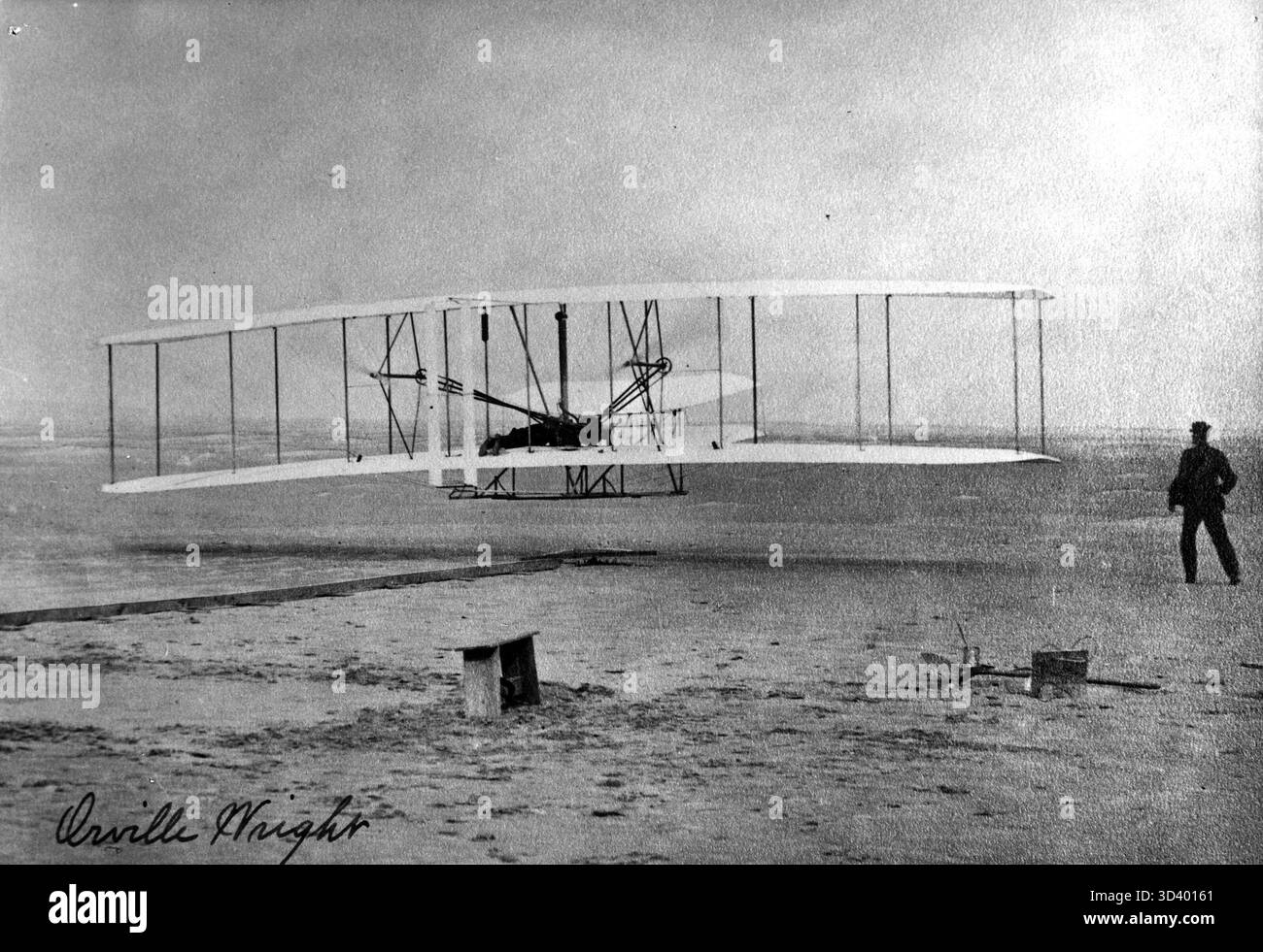 A 1903 image showing the Wright brothers, Wilbur and Orville, during ...
