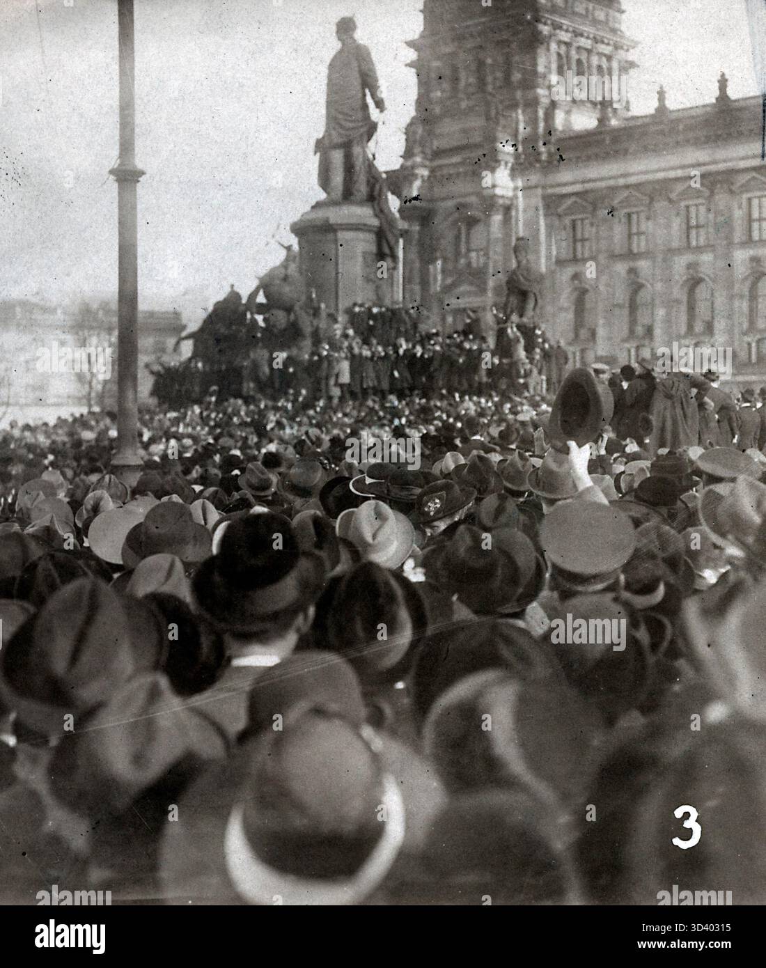 A crowd gathered at the Bismarck statue in Berlin in 1918, where ...