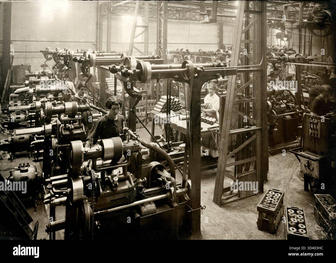 Workers in a French munitions factory in 1915 are shown operating ...