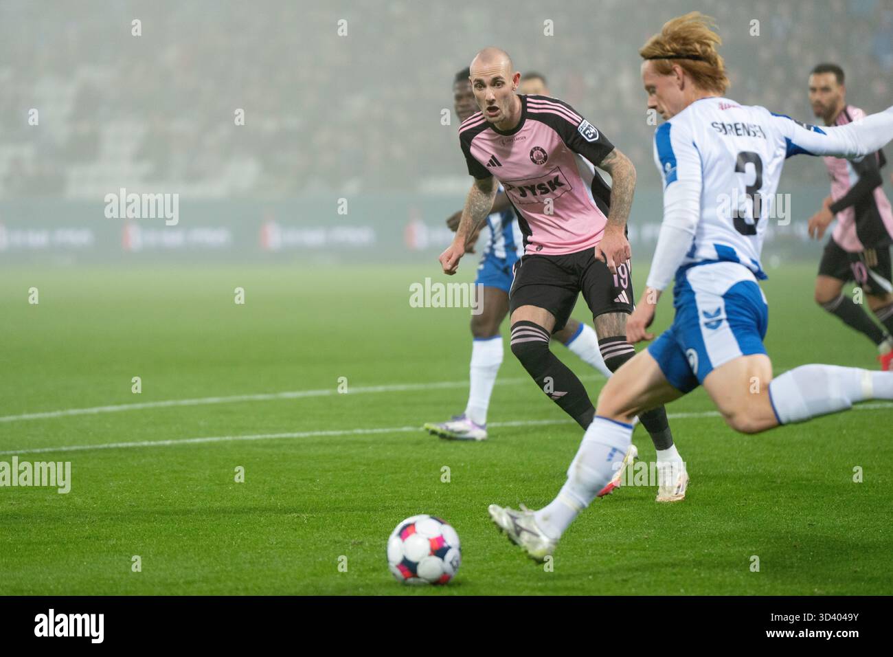 Silkeborg IF's Jens Martin Gammelby in battle with OB's Adam Soerensen ...