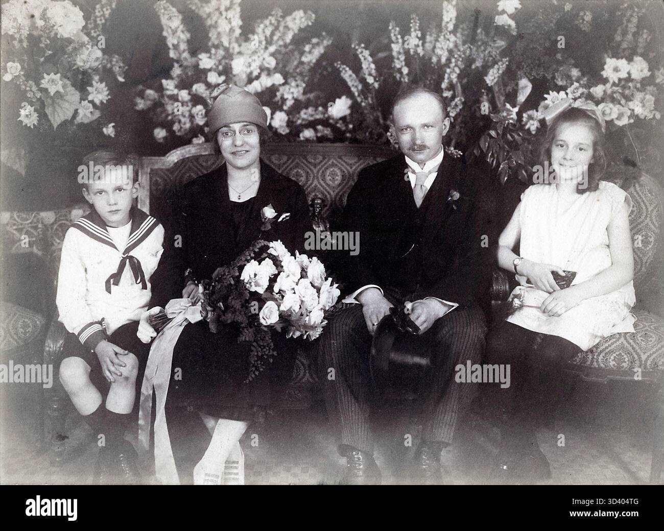 A family portrait taken between 1925 and 1935, featuring a father ...