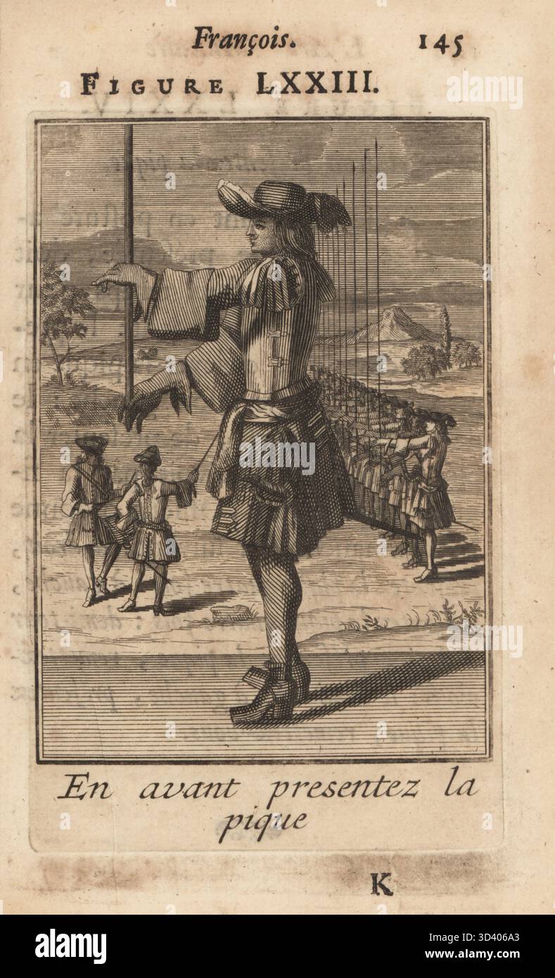 French pikeman presenting the pike forward. He holds the pike with both ...