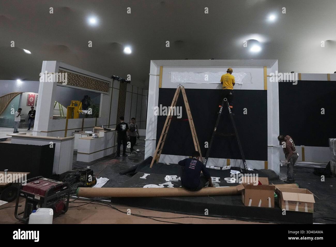 Construction workers prepare the venue for the COP30 U.N. Climate ...